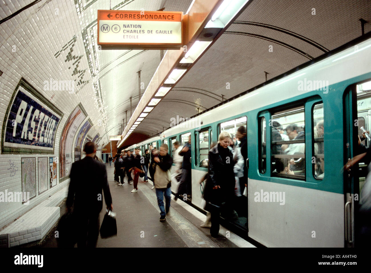 Passengers and a metro at Pasteur station in Paris Stock Photo - Alamy