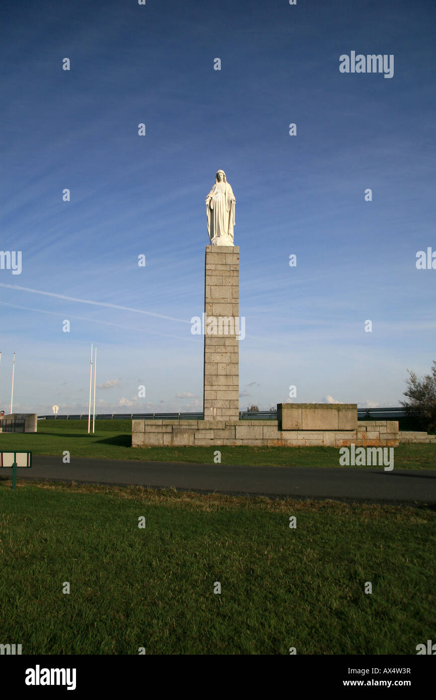 Statue of Mary above Arromanches beach, Normandy Stock Photo - Alamy