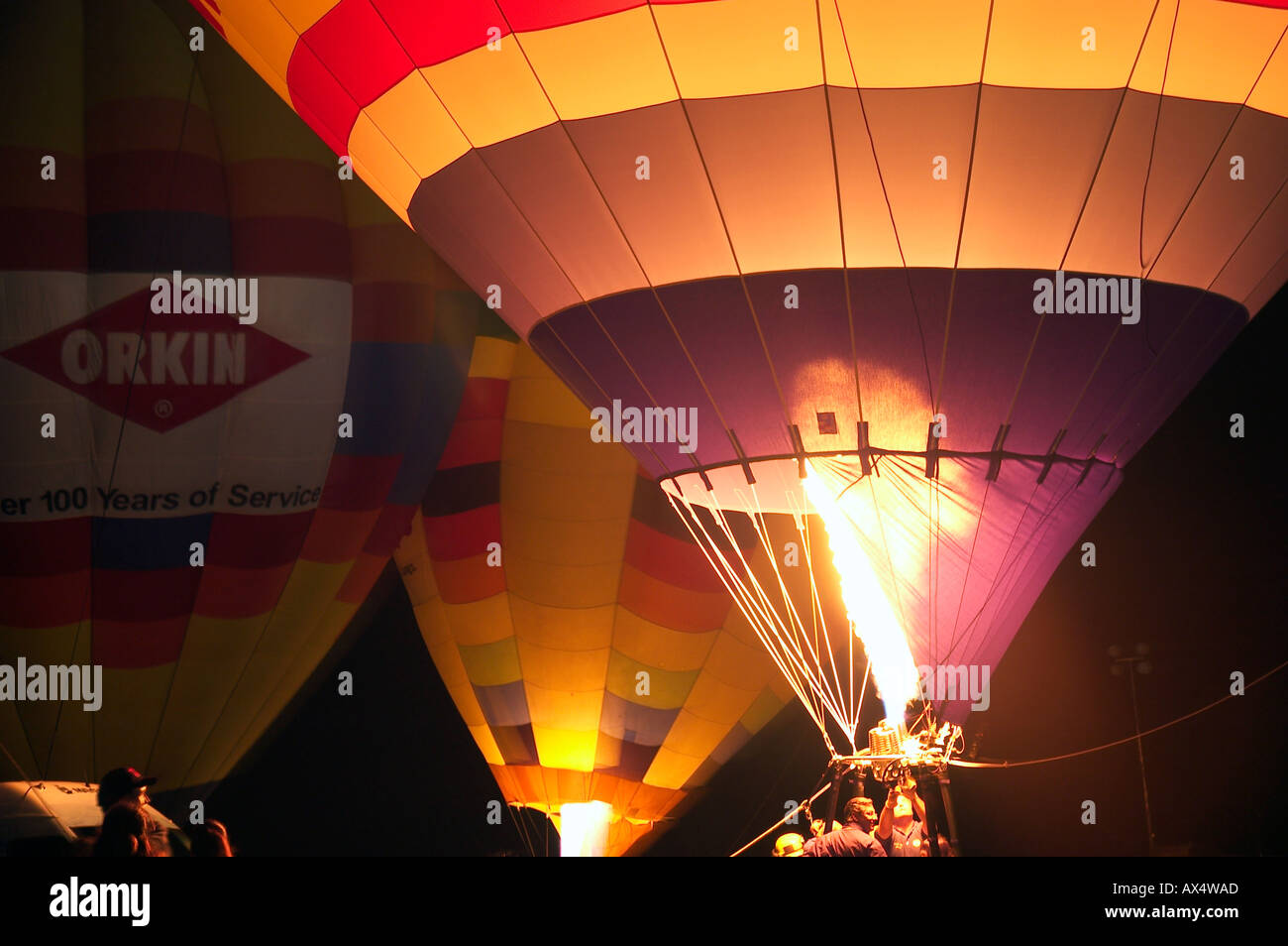 heating up hot air balloons at night Stock Photo - Alamy