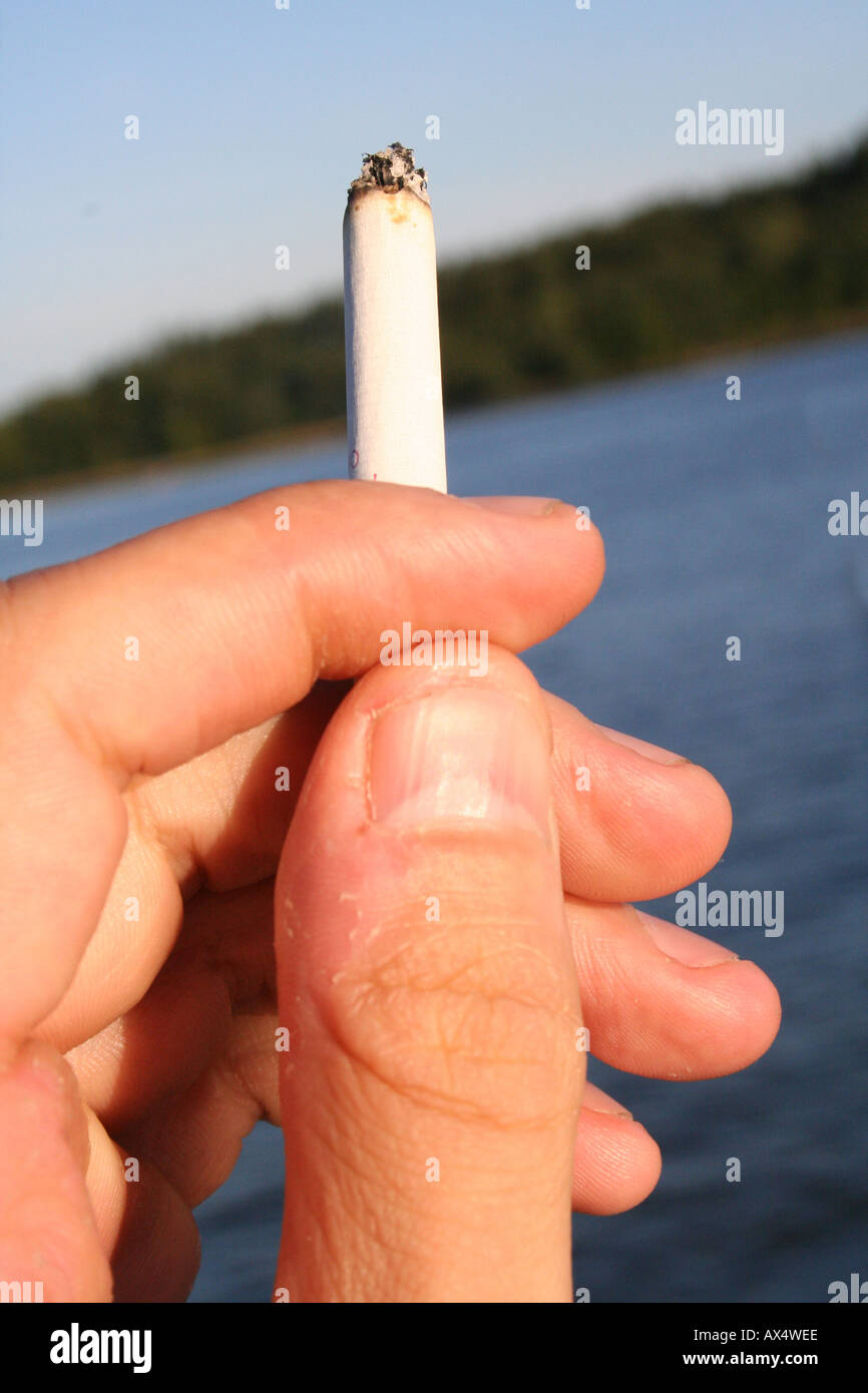 hand with sigarette Stock Photo - Alamy