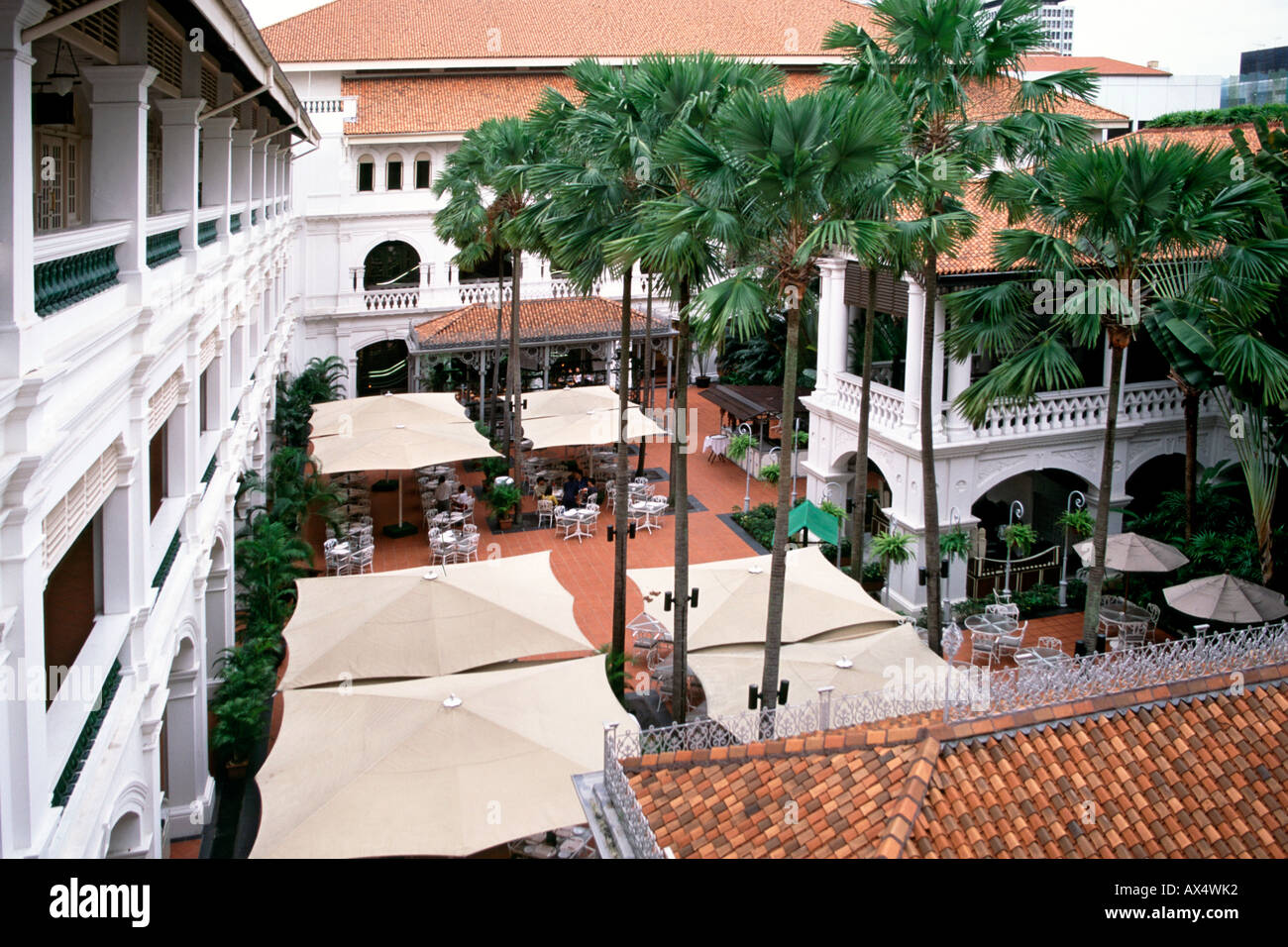 The interior courtyard of the Raffles hotel in Singapore Stock Photo ...