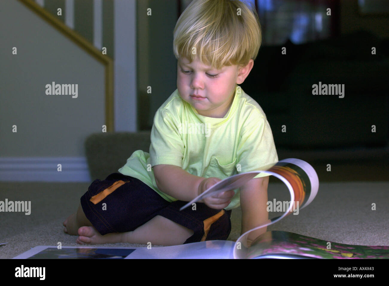 Toddler turning book pages hi-res stock photography and images - Alamy