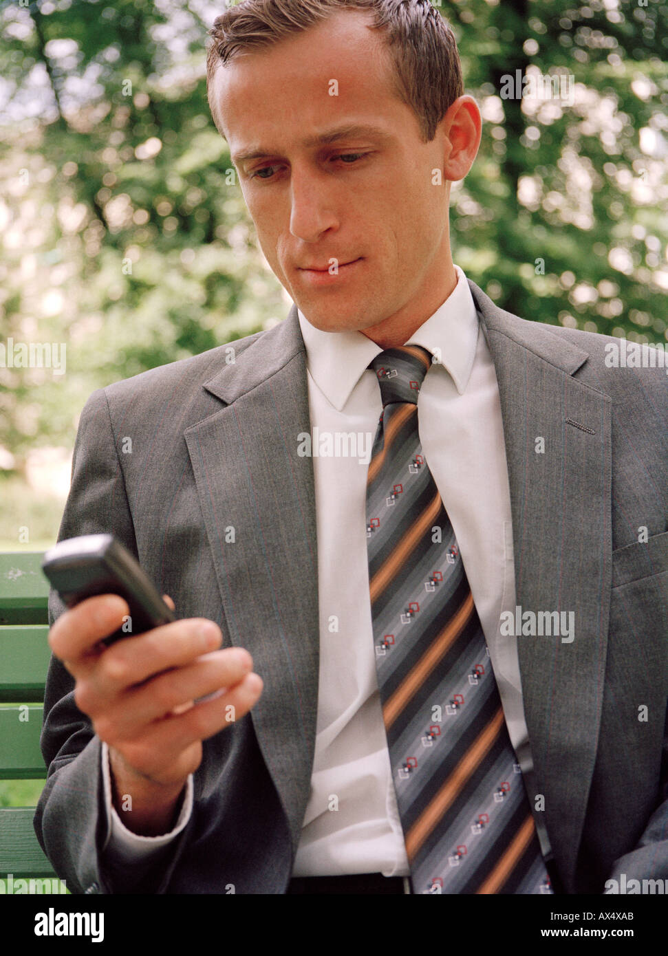 A businessman using a cell phone Stock Photo - Alamy