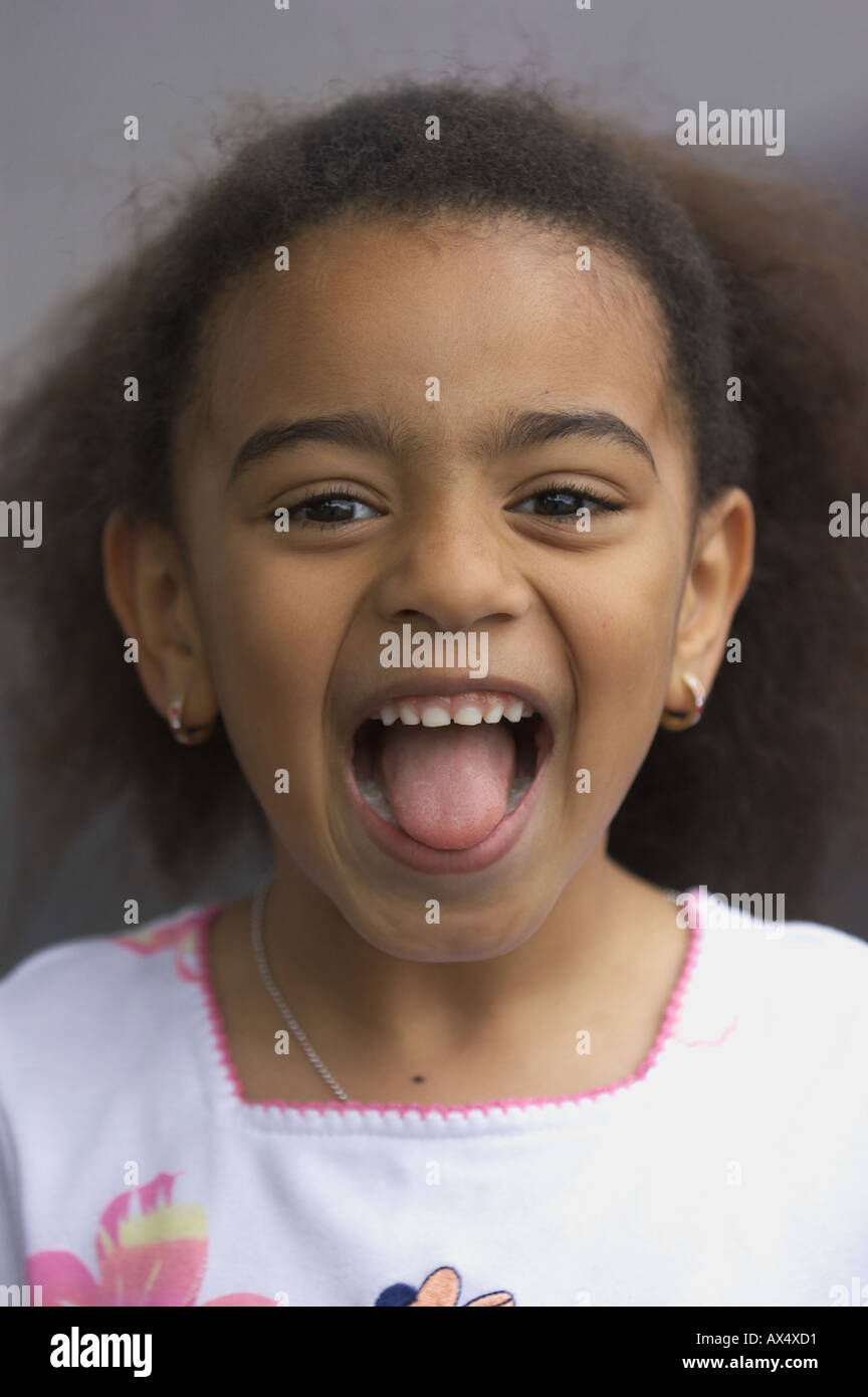 Hispanic girl with mouth open Stock Photo - Alamy