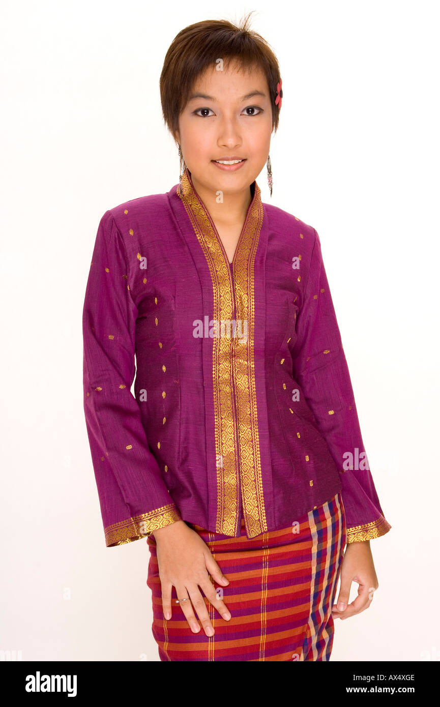 A pretty young asian girl wear brightly coloured traditional clothing ...