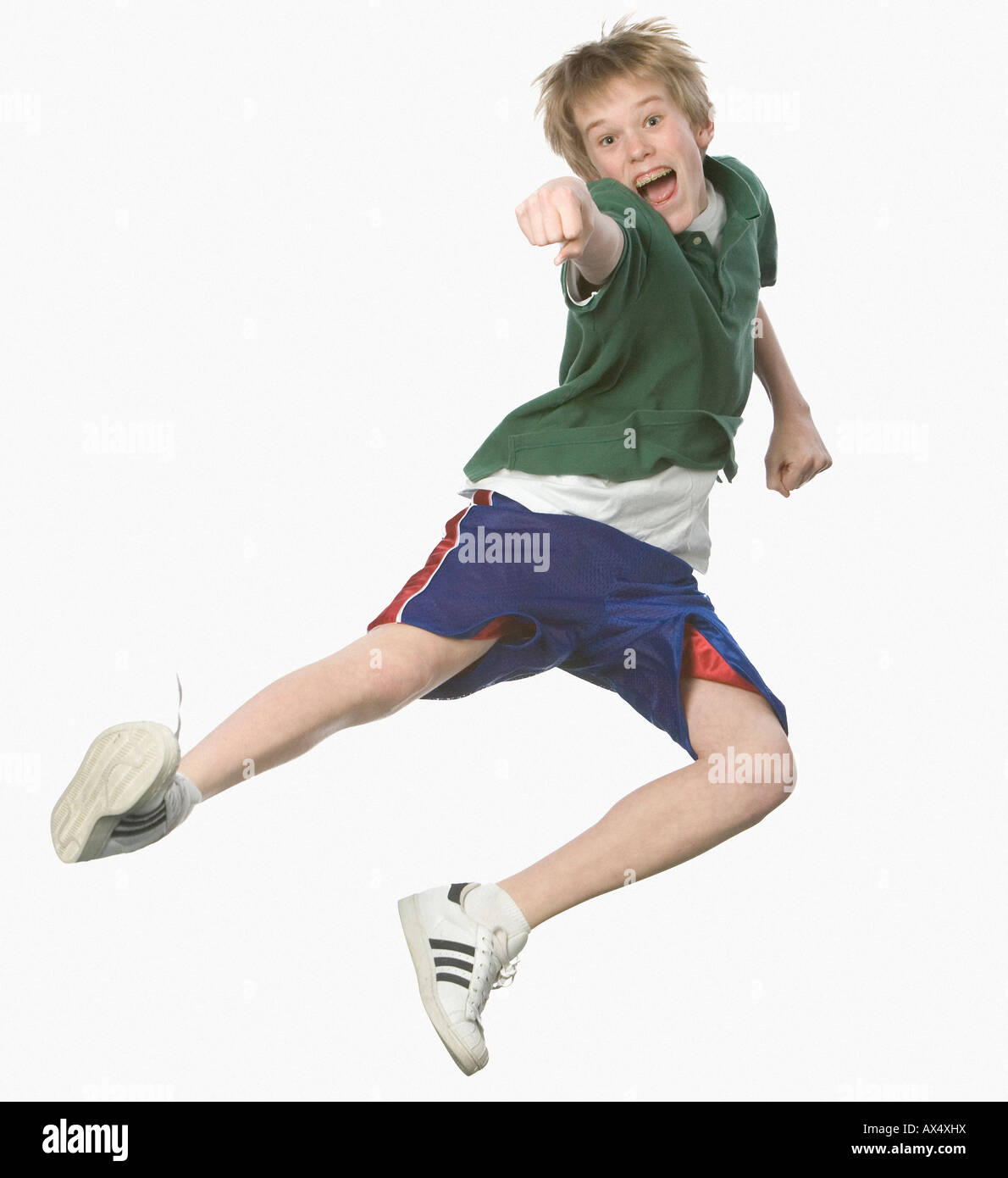 Jumping and Pointing Enthusiastic Teen Boy Stock Photo - Alamy