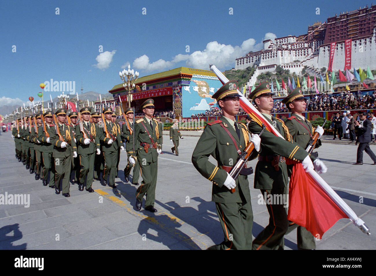 PLA soldiers march in front of the Potala Palace during a ceremony in ...