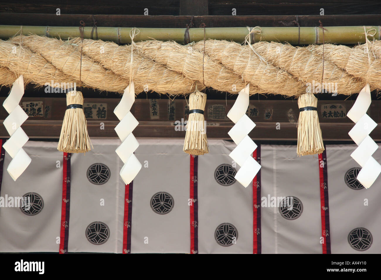 Straw rope and noren curtain at the entrance to a shinto shrine in ...