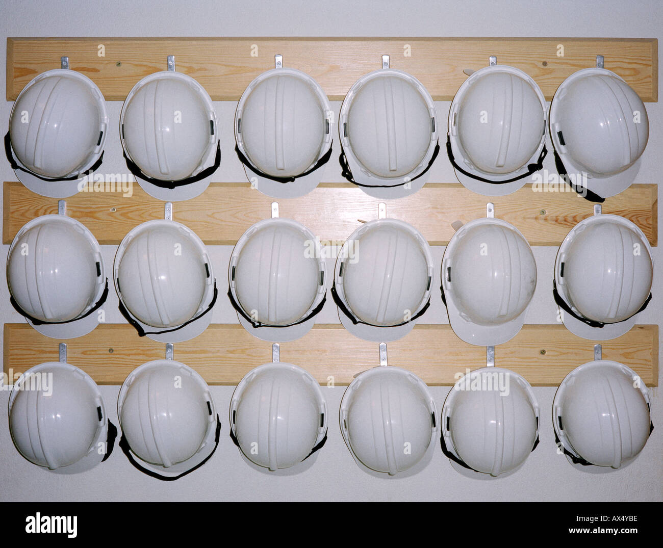 Rows of hardhats Stock Photo - Alamy