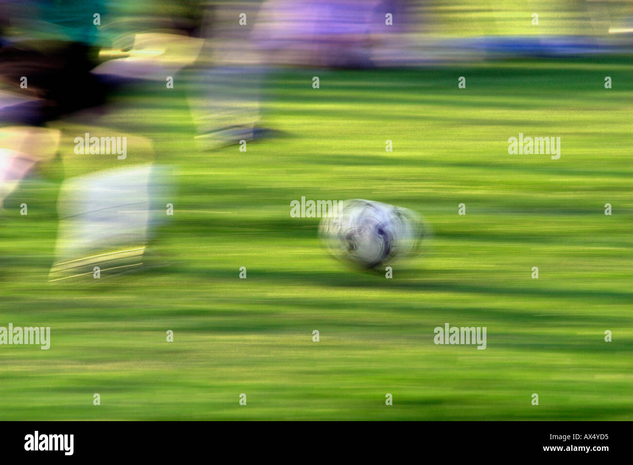 chasing soccer ball during game Stock Photo - Alamy