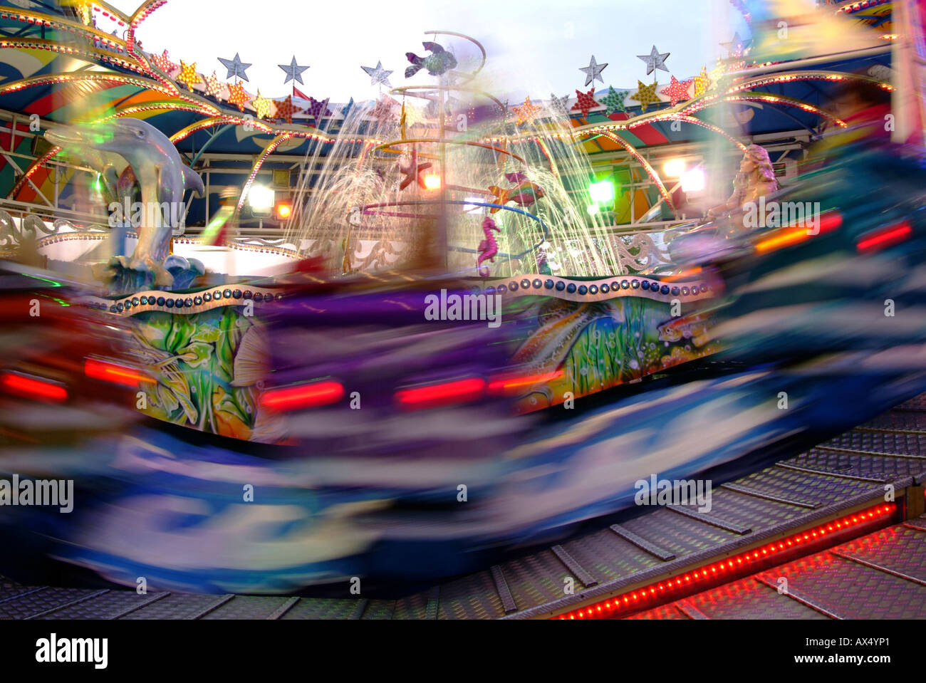Merry-go-round in motion Stock Photo - Alamy