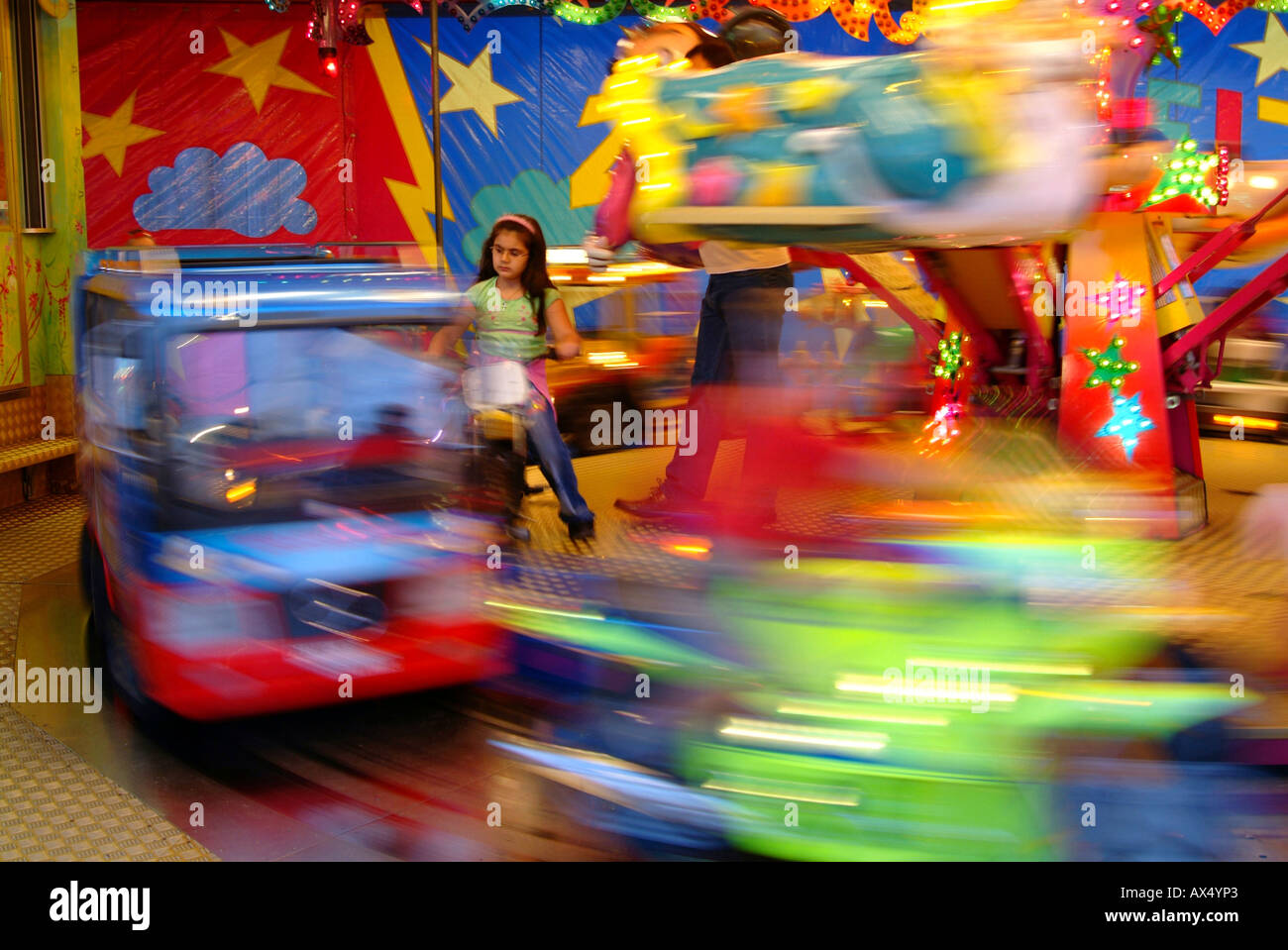 Merry-go-round in motion Stock Photo - Alamy