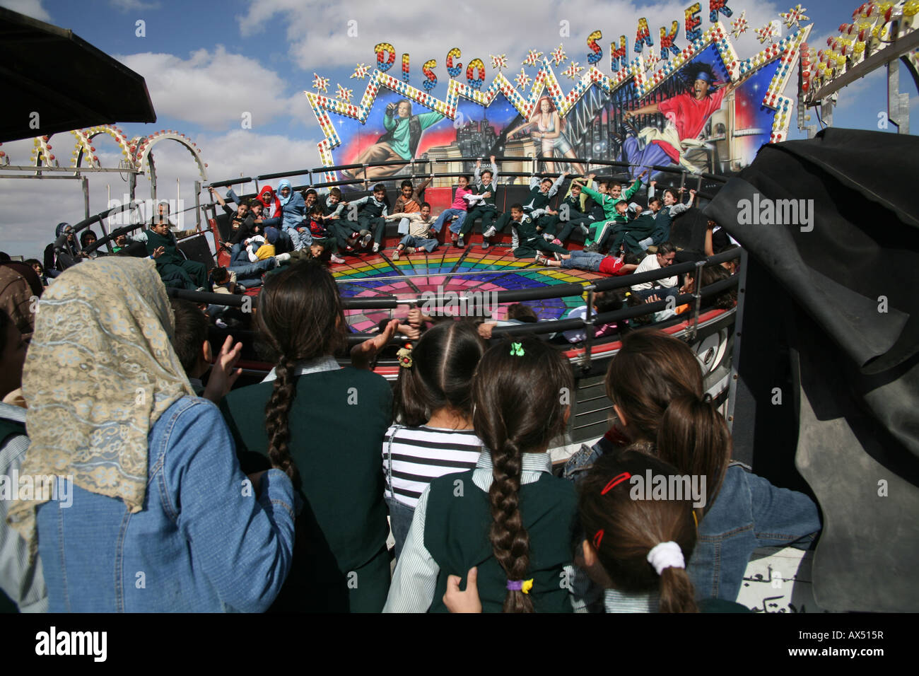 school children playing at a fair in Amman, jordan Stock Photo - Alamy