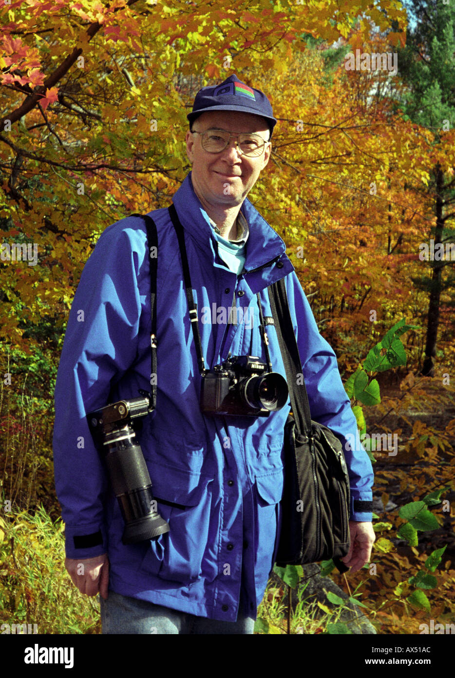 Photographer with Nikon cameras Stock Photo - Alamy
