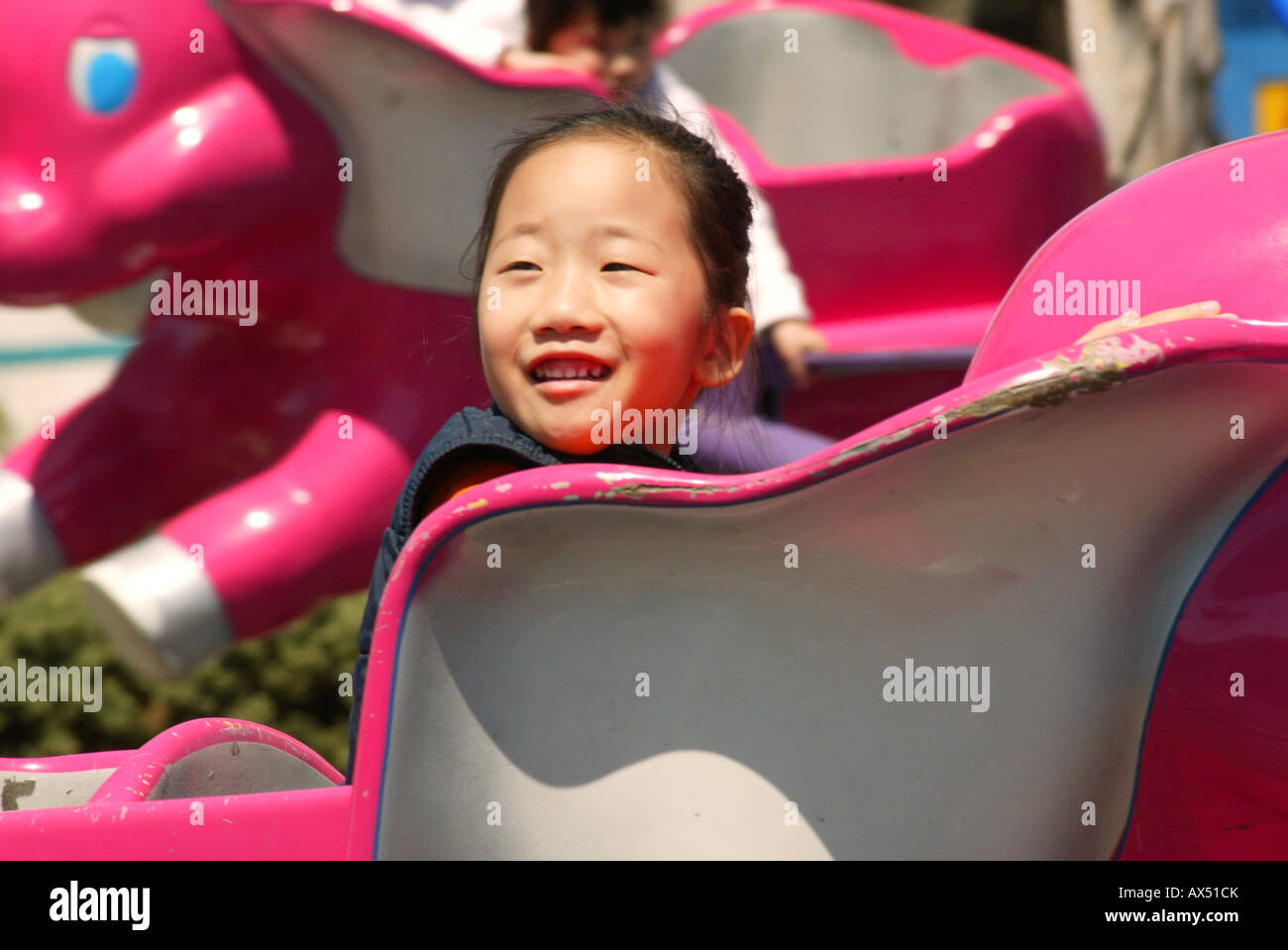 Korean child enjoys carnival ride at Korean Festival Garden Grove ...