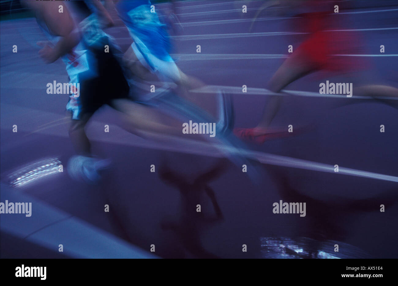 Track runners compete in the 4X100 meter relay Stock Photo - Alamy