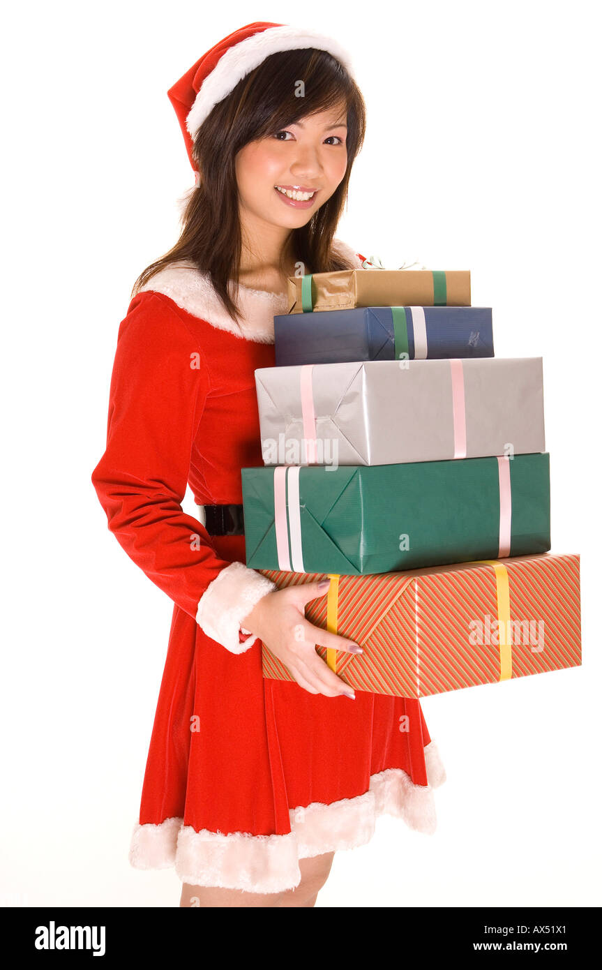 A cute asian Miss Santa with lots of different colored presents Stock ...