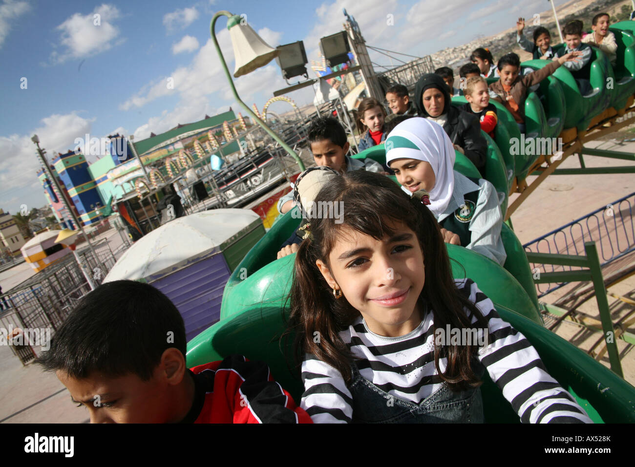 school children playing at fair in Amman, jordan Stock Photo - Alamy