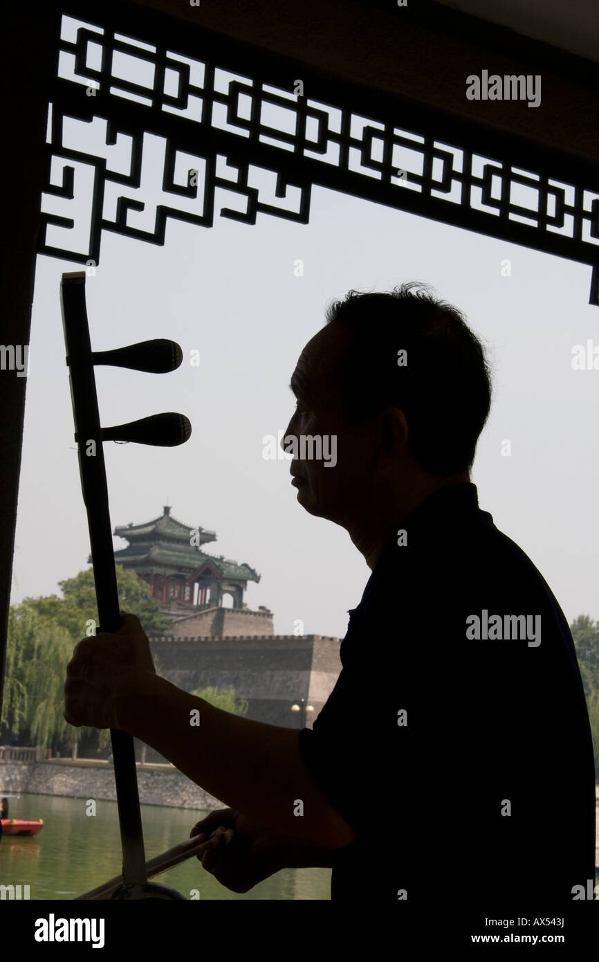 Chinese man play two-stringed fiddle, musical instruments Stock Photo ...