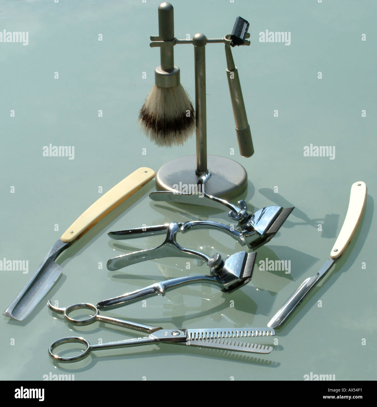 Selection of Old Barbers Shop Tools on a Glass Table Top Stock Photo ...
