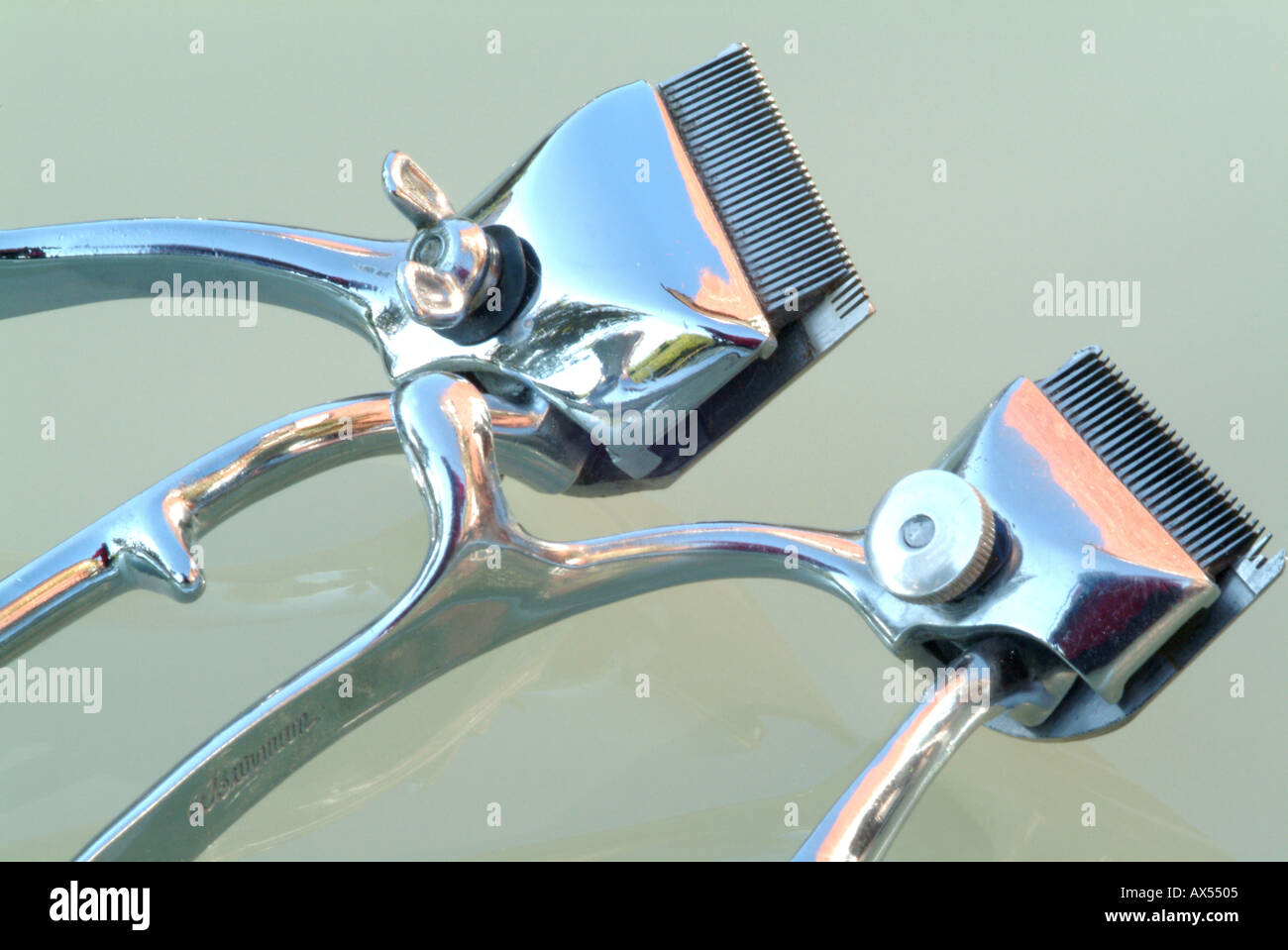A Pair of Old Antique Barbers Clippers on a Glass Table Top Stock Photo ...