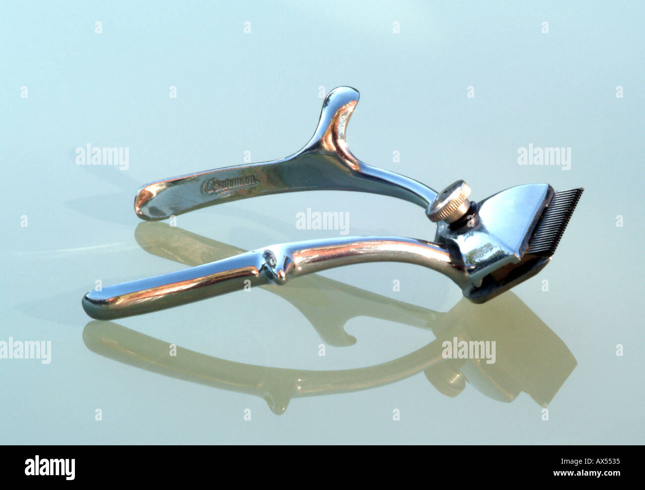 Old Antique Barbers Clippers on a Glass Table Top Stock Photo - Alamy