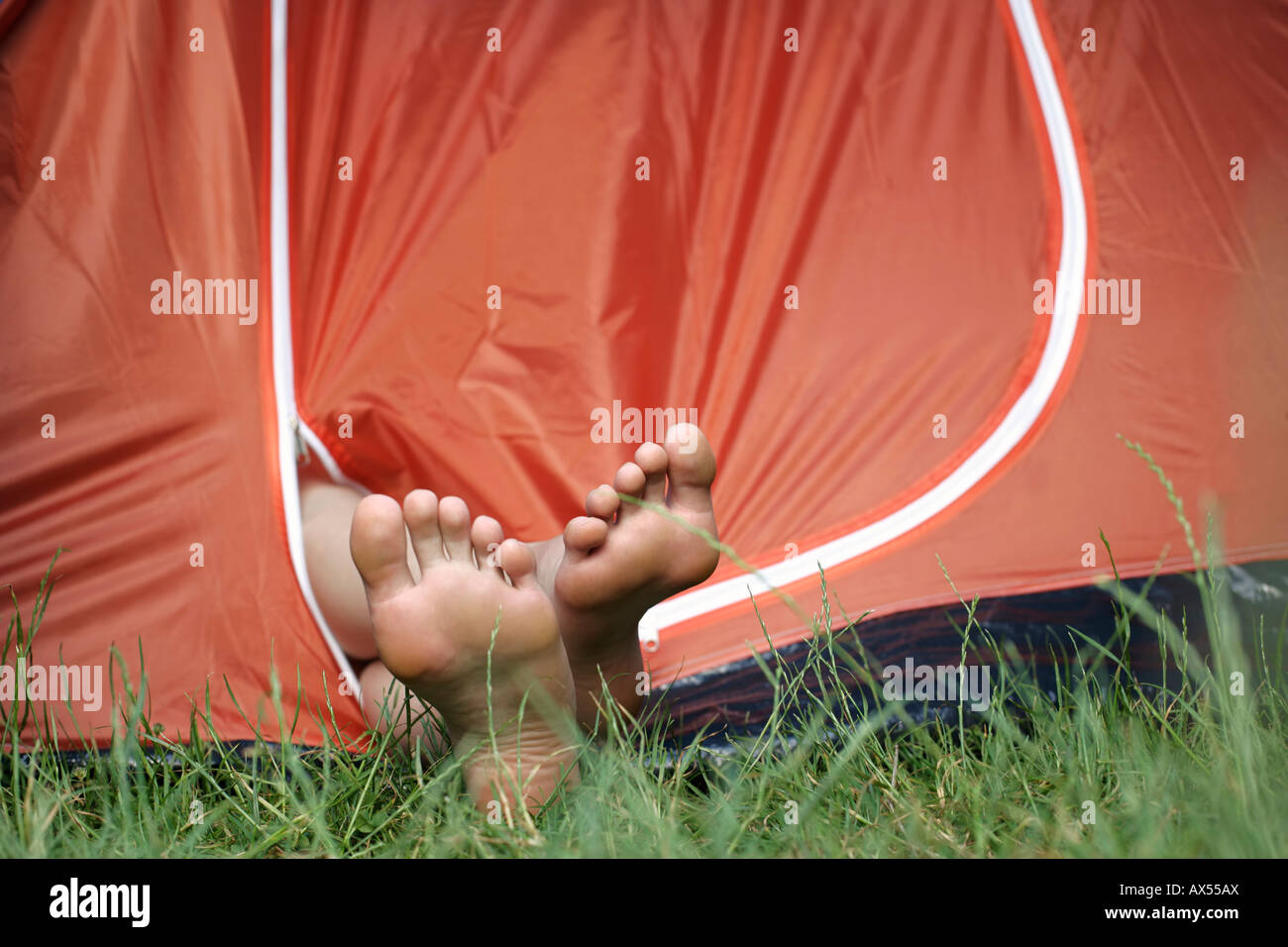 Female feet sticking out of a tent Stock Photo - Alamy