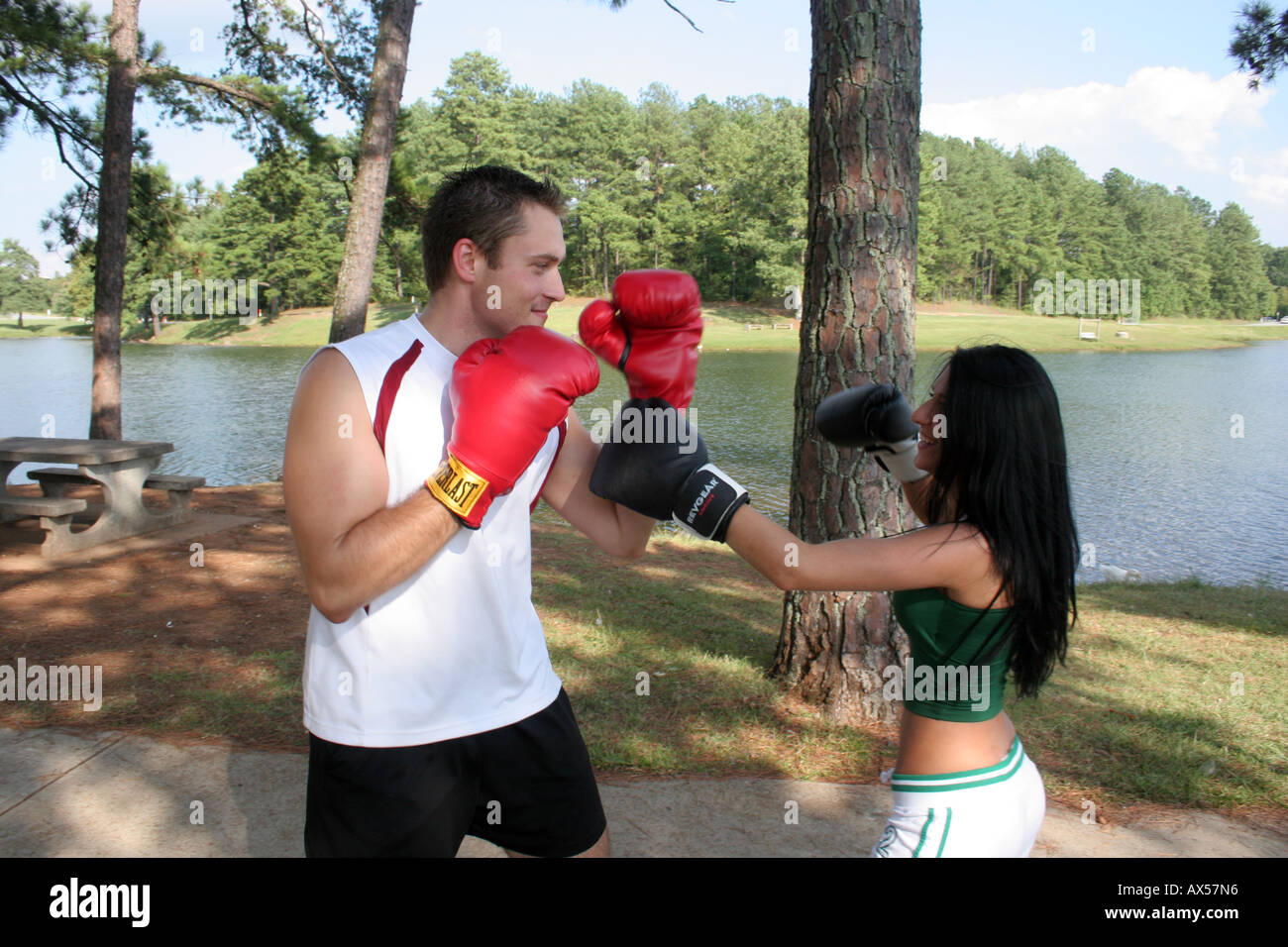A caucasian couple outside boxing with boxing gloves Stock Photo - Alamy