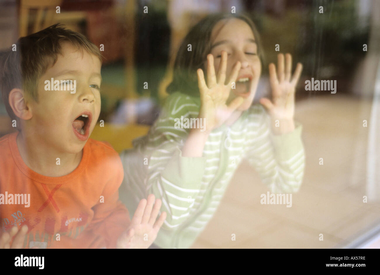 Children behind window pane Stock Photo - Alamy