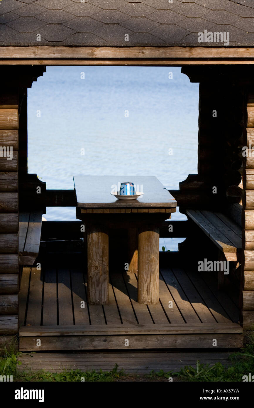 Small wooden log hut on waterfront Stock Photo - Alamy
