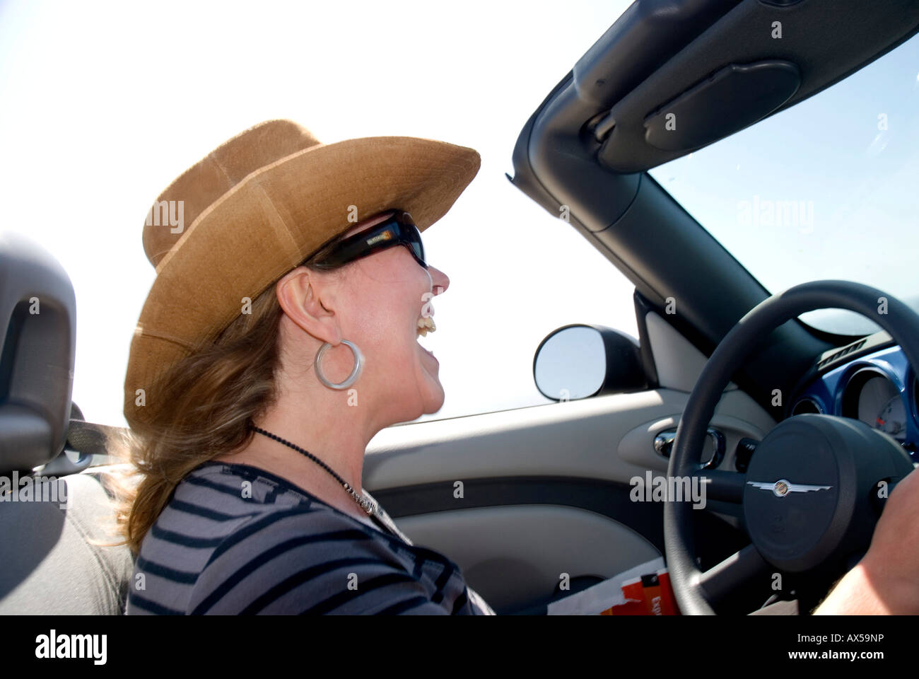 Female convertible car wind hi-res stock photography and images - Alamy