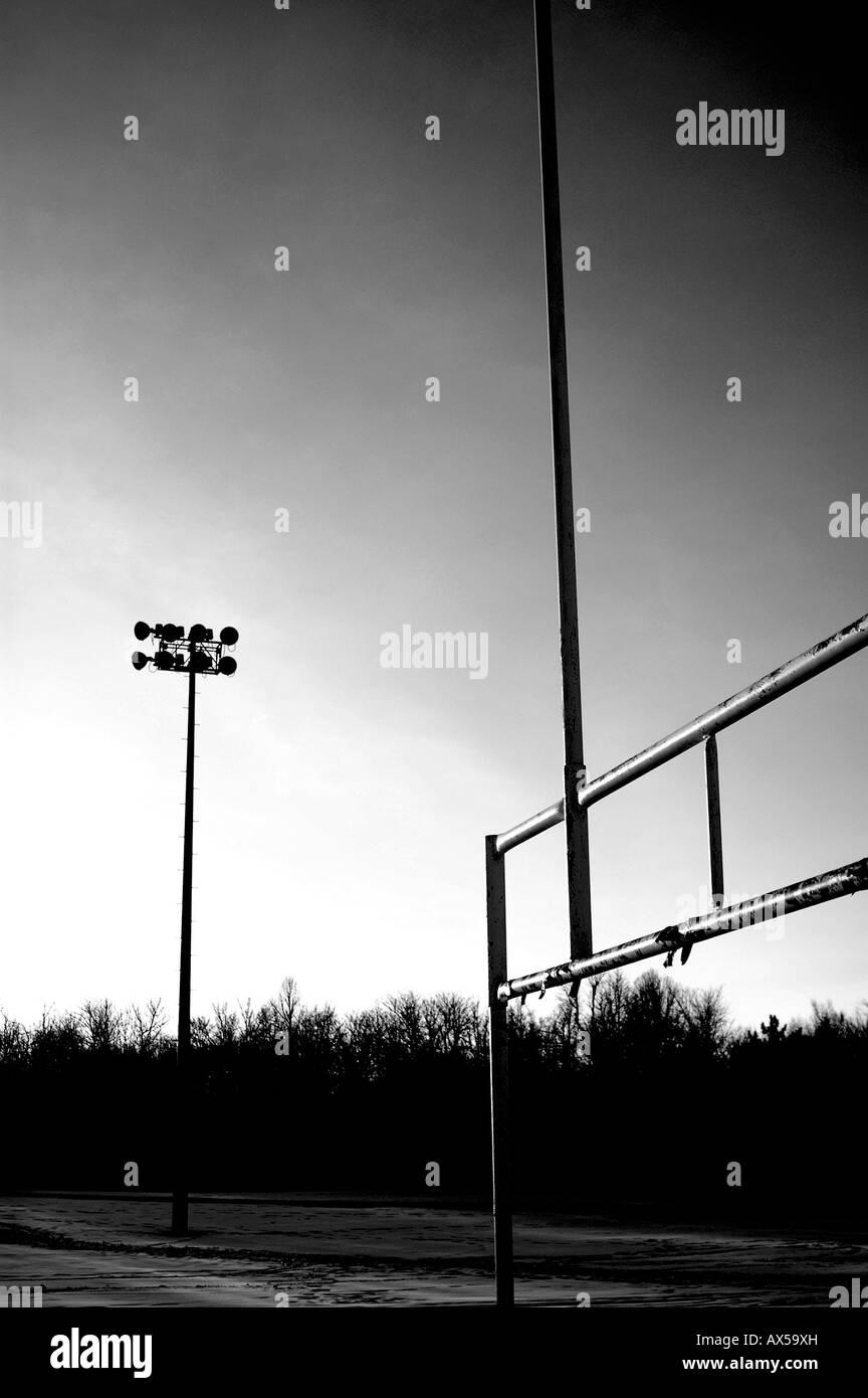 A football goal post infront of a stadium light structure Stock Photo ...