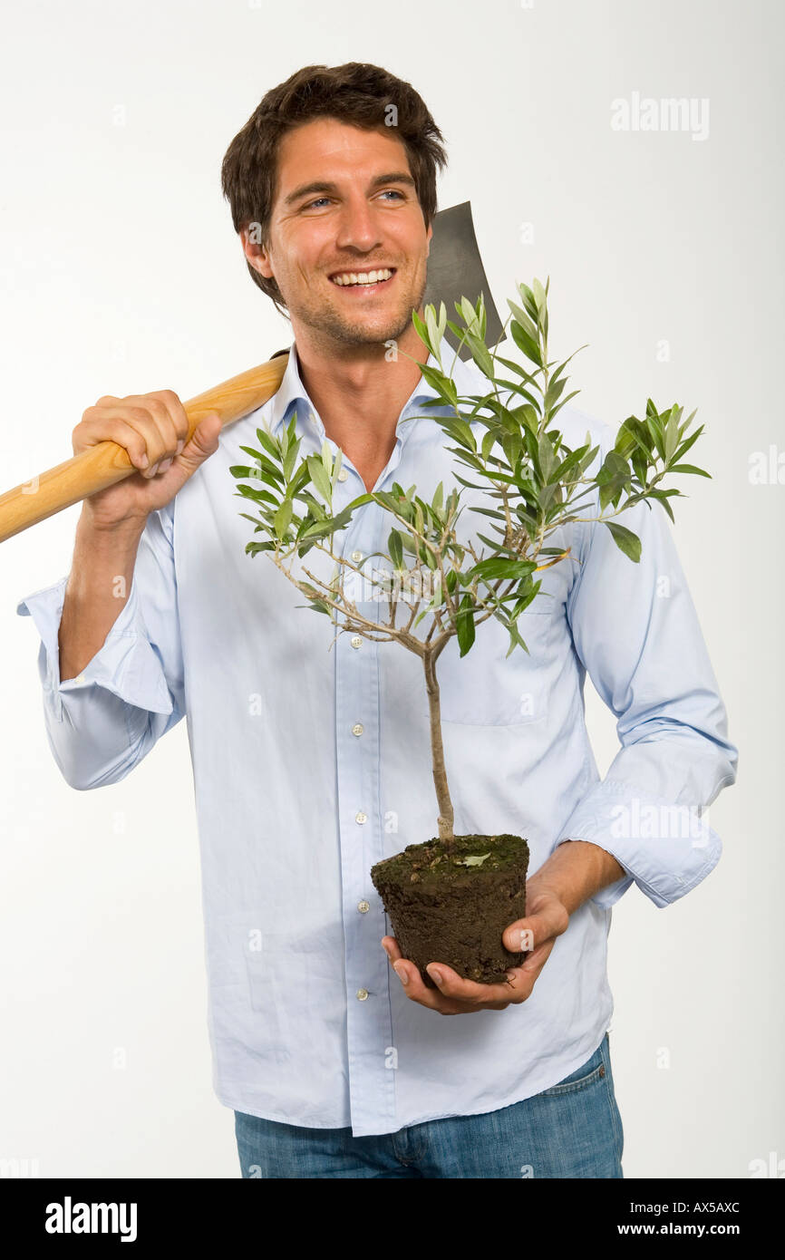 Man carrying pot plants hi-res stock photography and images - Alamy