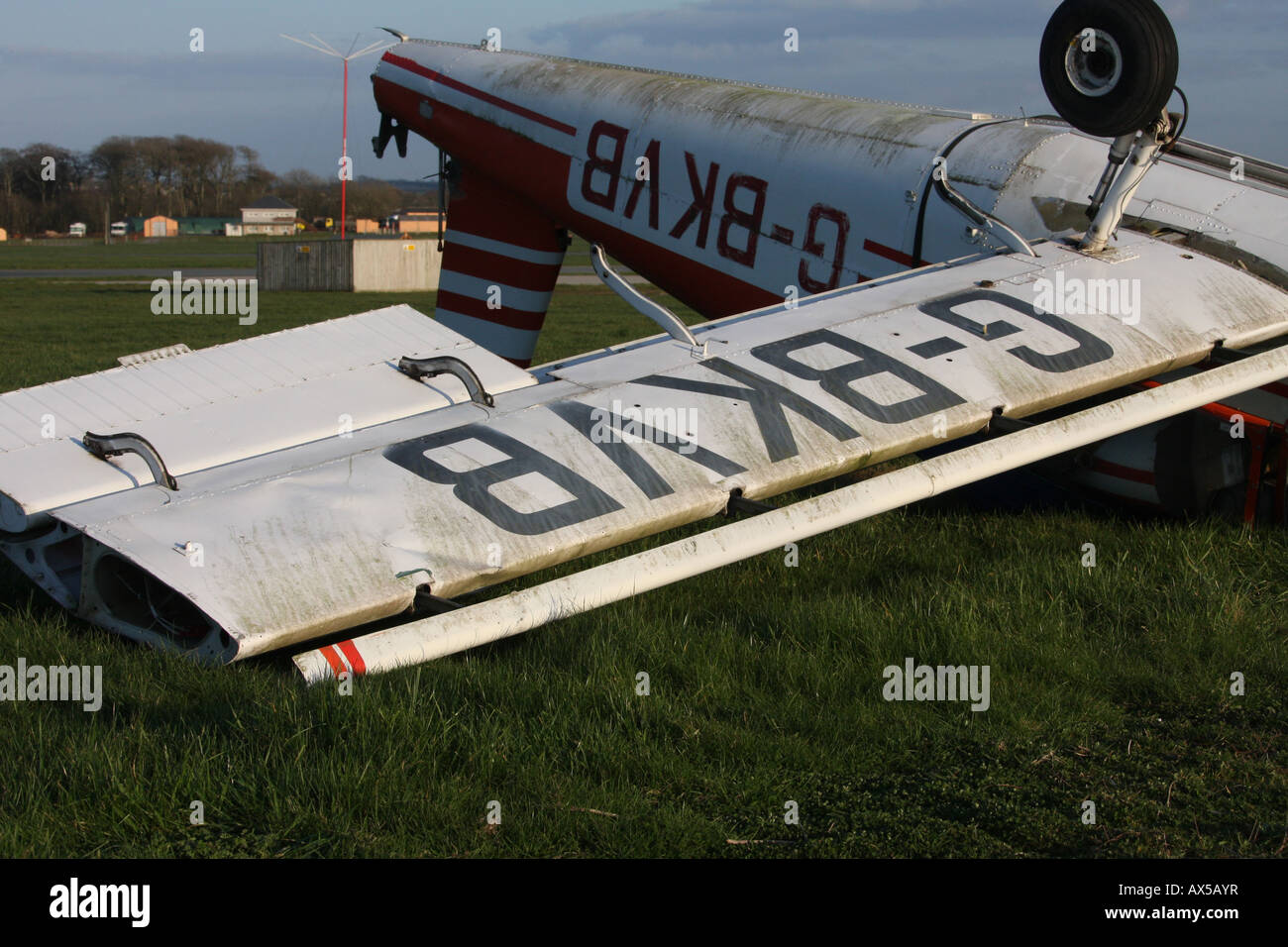 Small Airplane crash upside down on airfield, blown by gust of wind ...