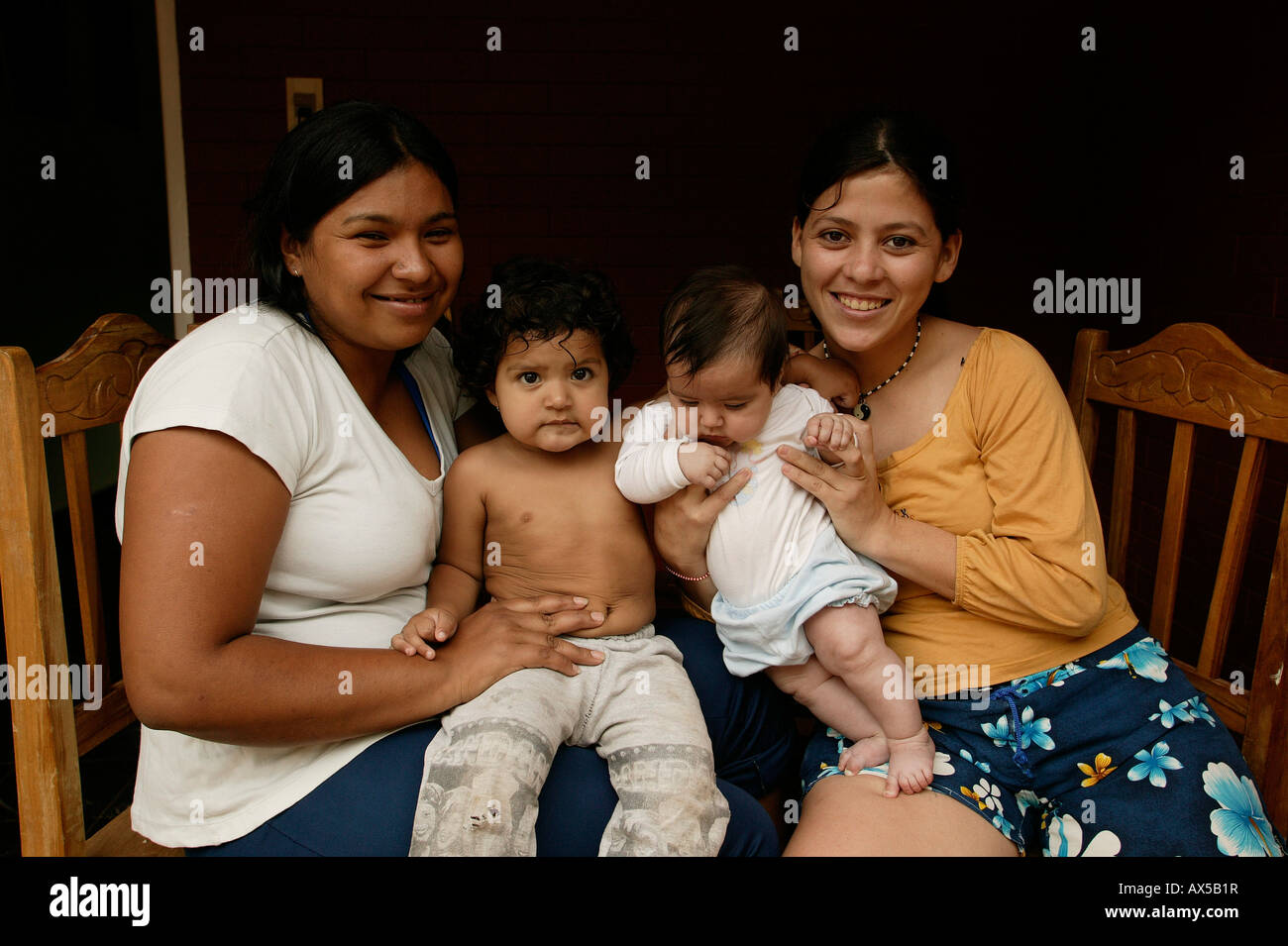 Two mothers with their children, toddler and baby, Asuncion, Paraguay ...