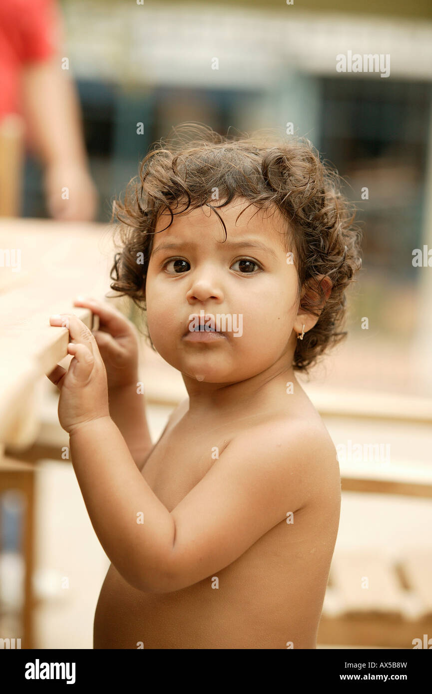 Toddler at table, Asuncion, Paraguay, South America Stock Photo - Alamy