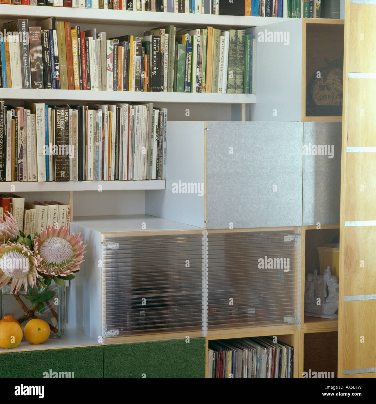 Close up of perspex storage boxes on bookshelves Stock Photo - Alamy