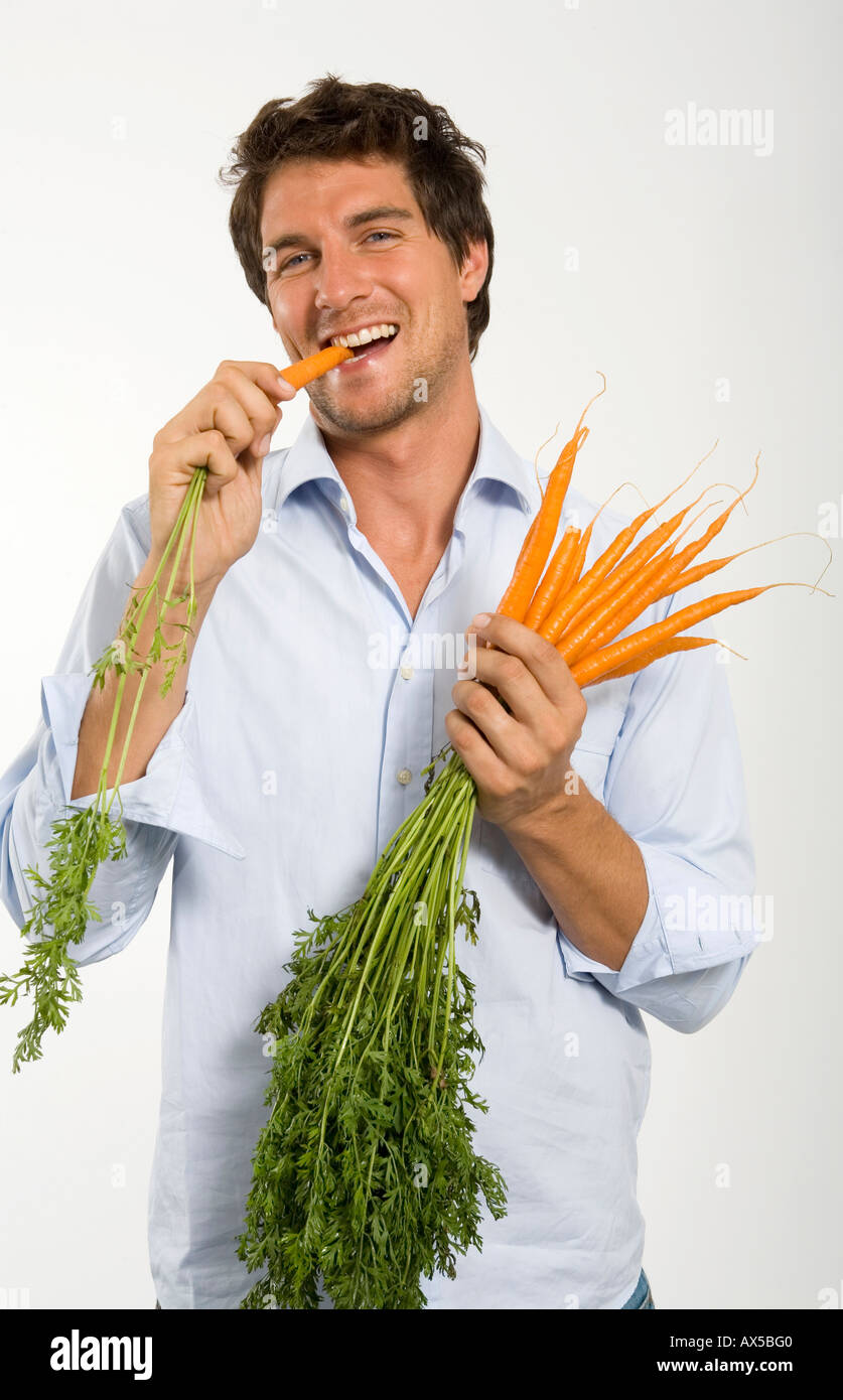 Fresh grown carrots on white hi-res stock photography and images - Alamy