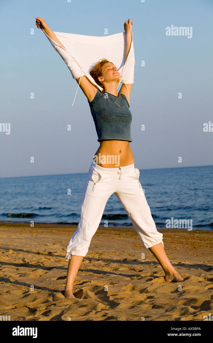 Stretching curly haired woman hi-res stock photography and images - Alamy