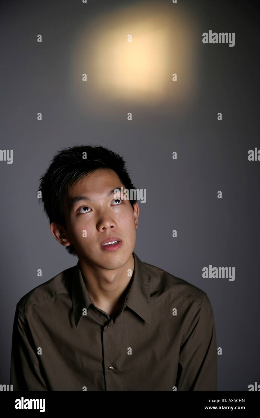 Young man looking up Stock Photo - Alamy