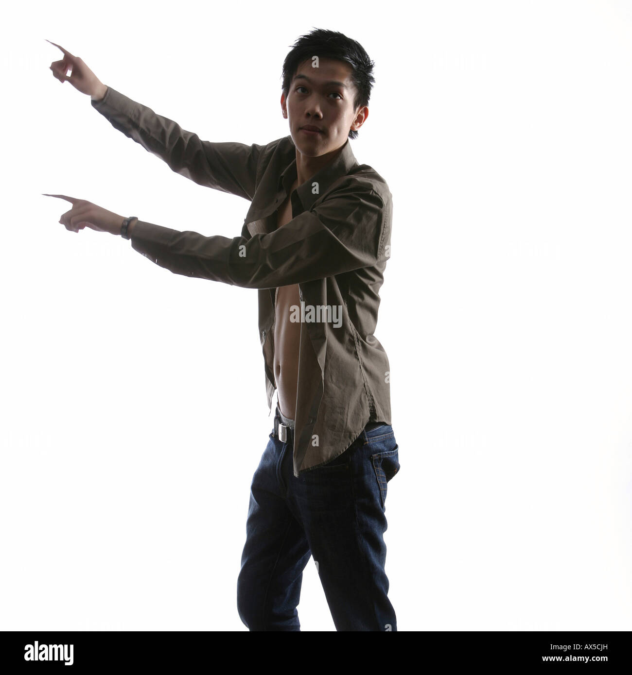 Young man pointing to the side Stock Photo - Alamy