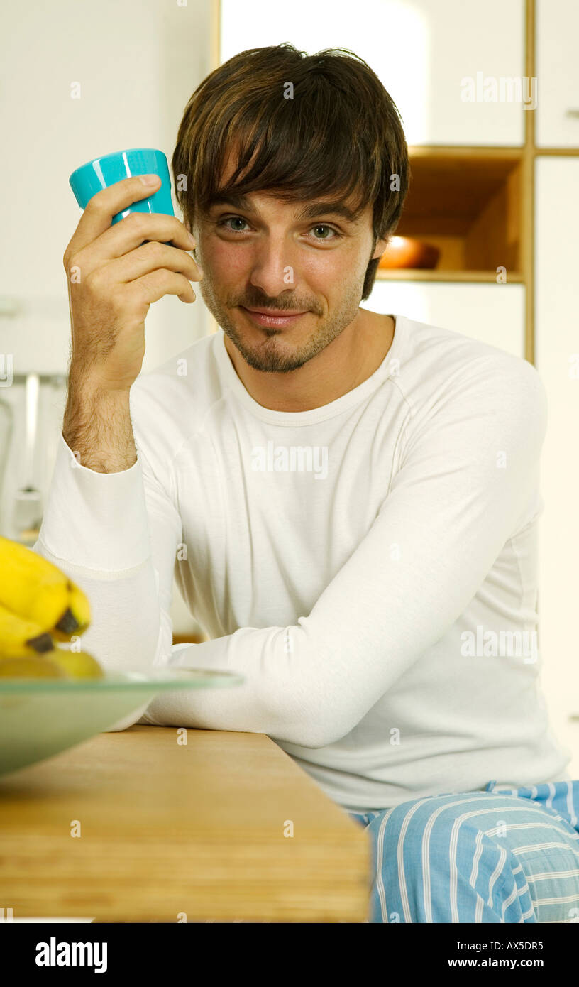 Young man in kitchen, portrait Stock Photo - Alamy
