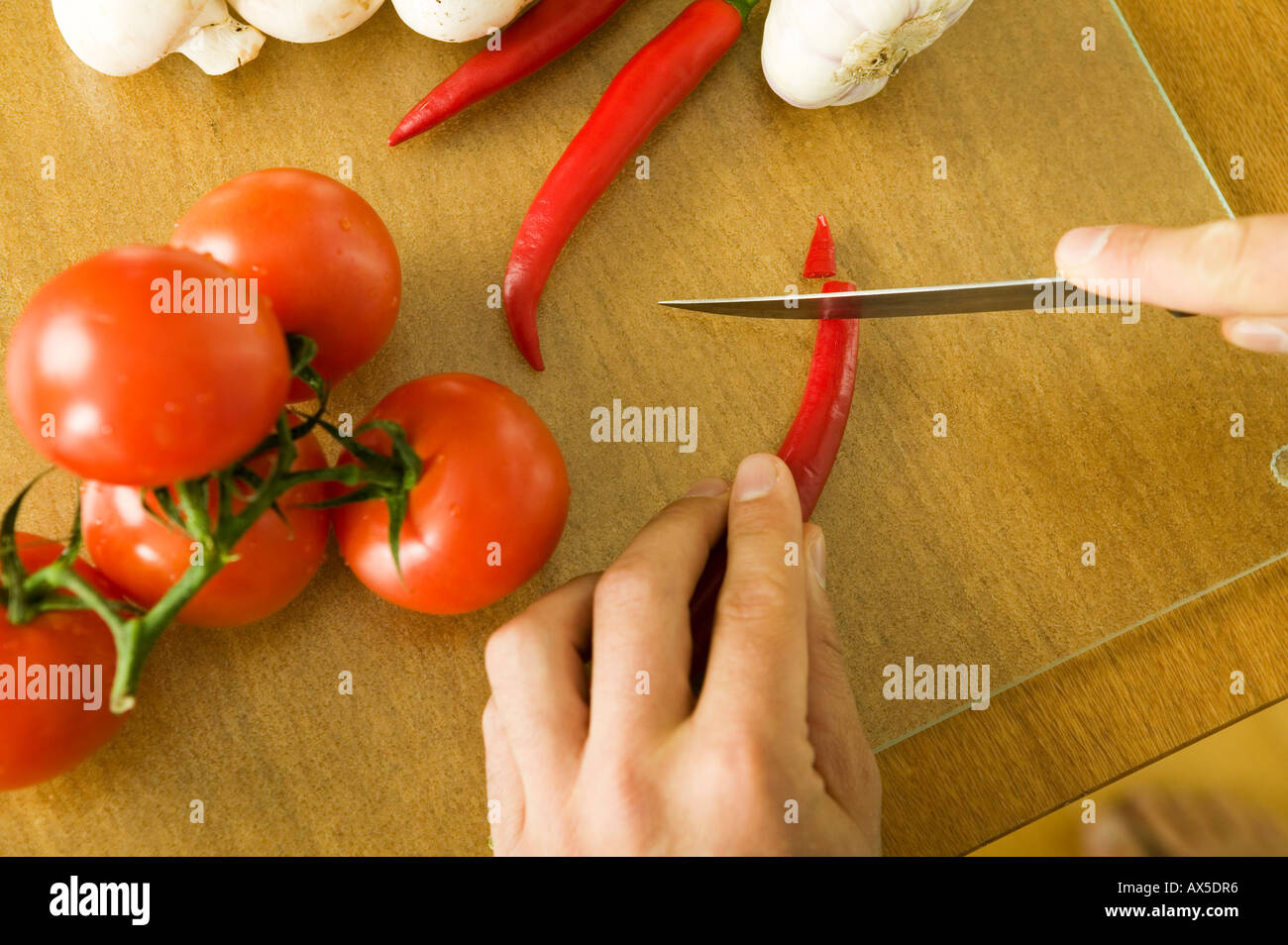 Chilli chopping prepare hands hi-res stock photography and images - Alamy