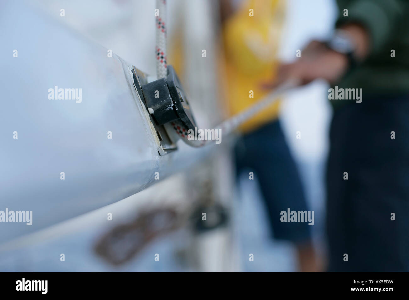 Hoisting of a sail Stock Photo - Alamy