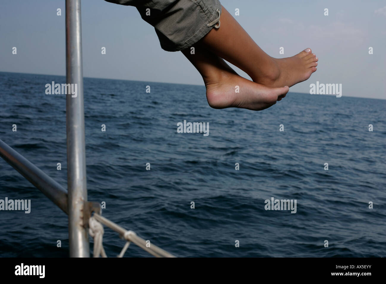 Women legs dangling hi-res stock photography and images - Alamy