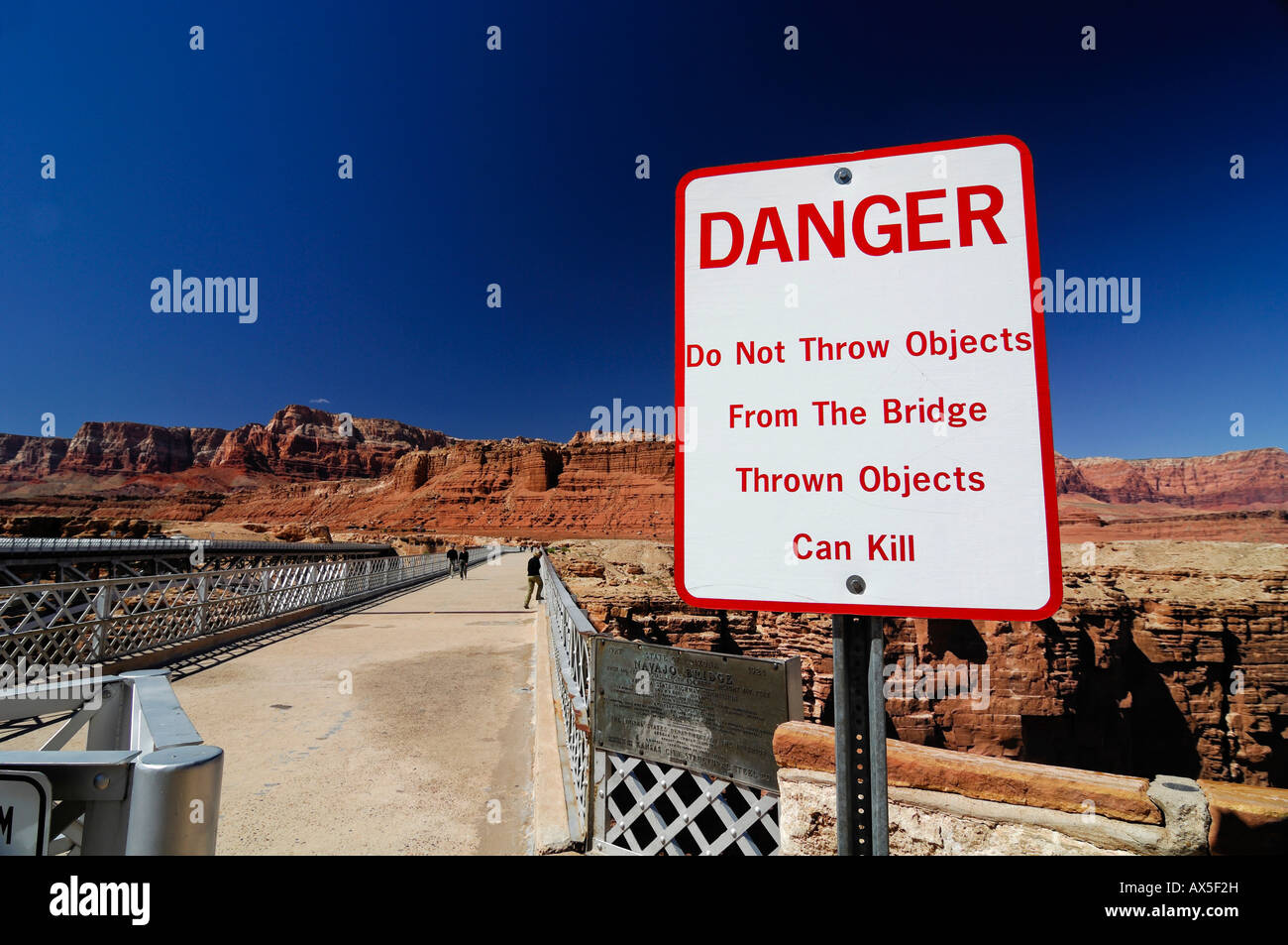Warning sign posted at Navajo Bridge, bridge going over the Colorado ...