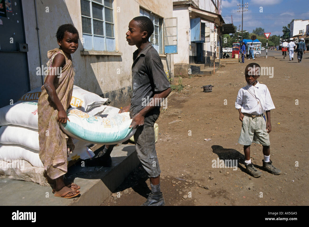Children carry heavy hi-res stock photography and images - Alamy