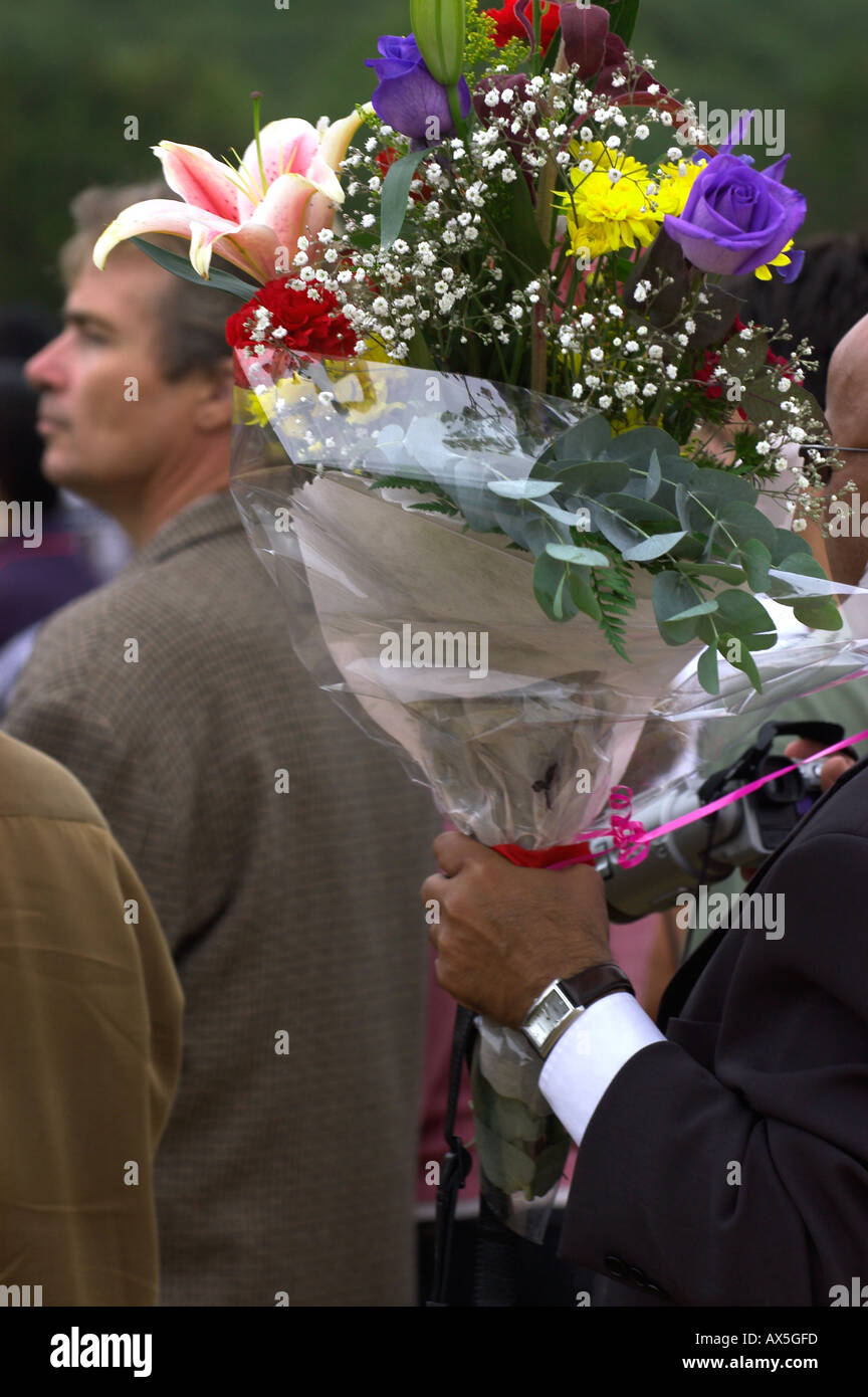 Graduate holding bouquet flowers graduation hi-res stock photography ...