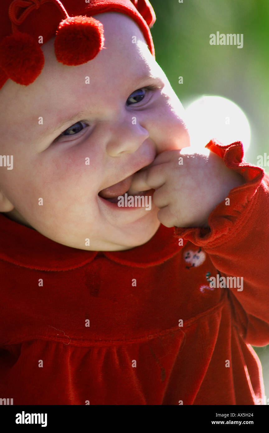 baby in red outfit Stock Photo - Alamy