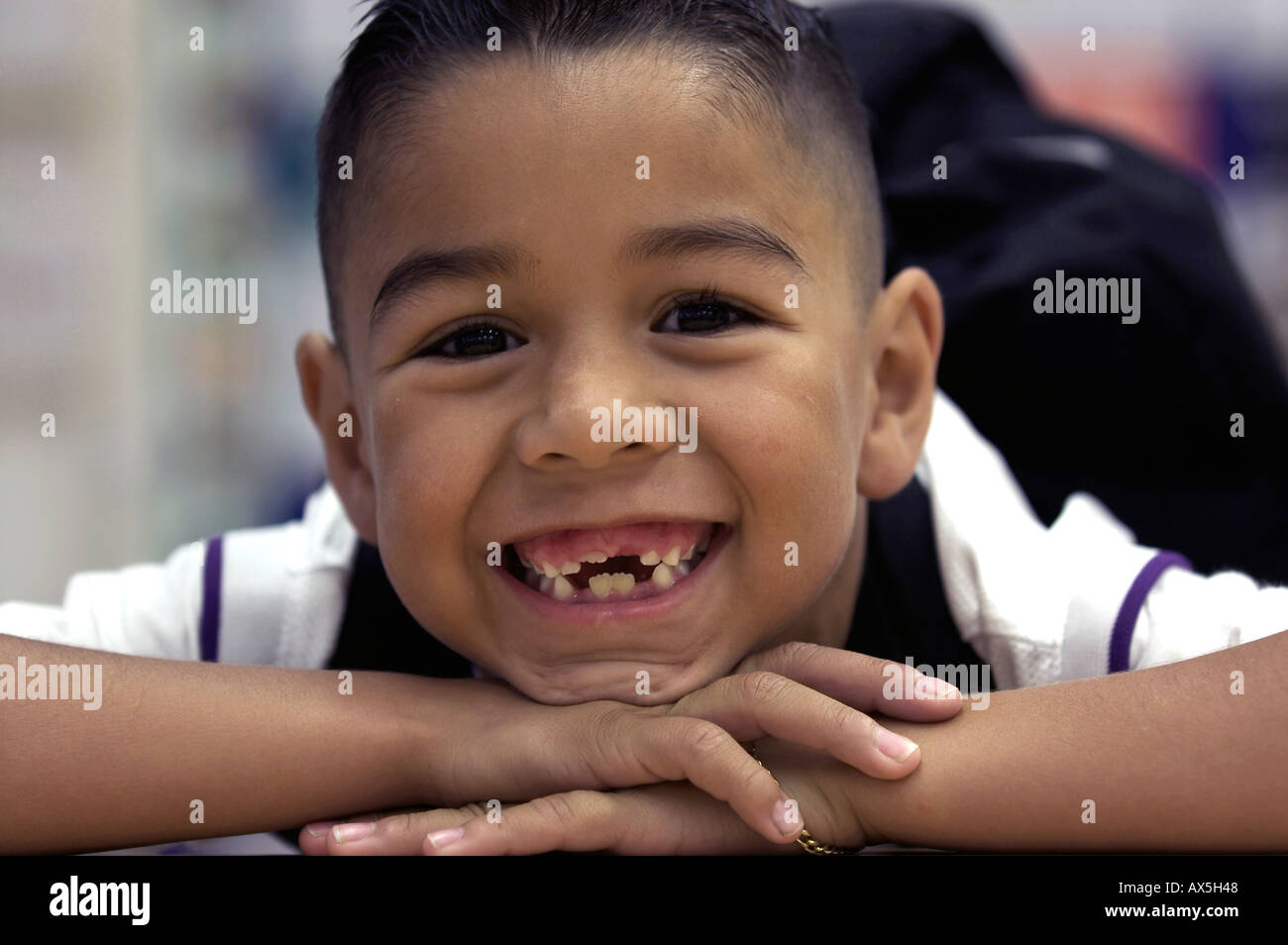 Hispanic boy with teeth missing Stock Photo - Alamy